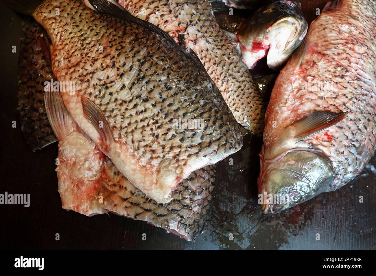Freshly peeled carp fish on the table Stock Photo - Alamy