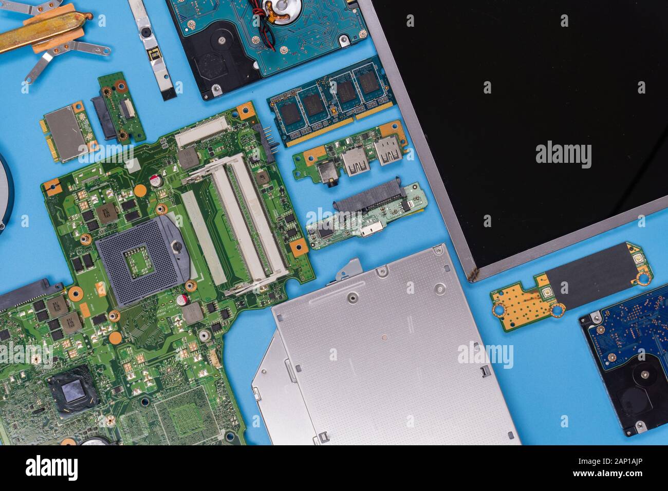 Parts of a modern computer. The insides of a laptop on a blue ...