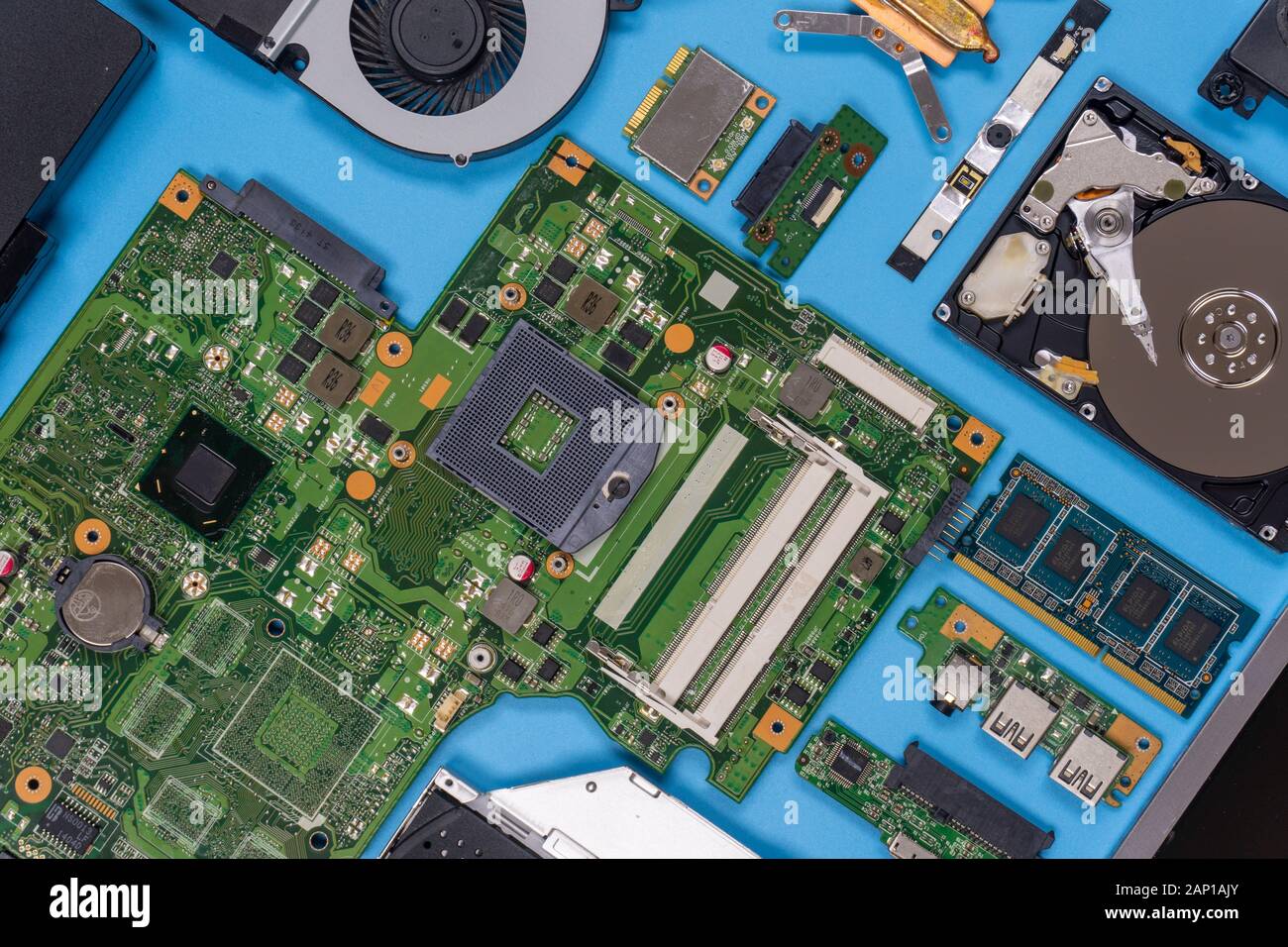 Parts of a modern computer. The insides of a laptop on a blue ...