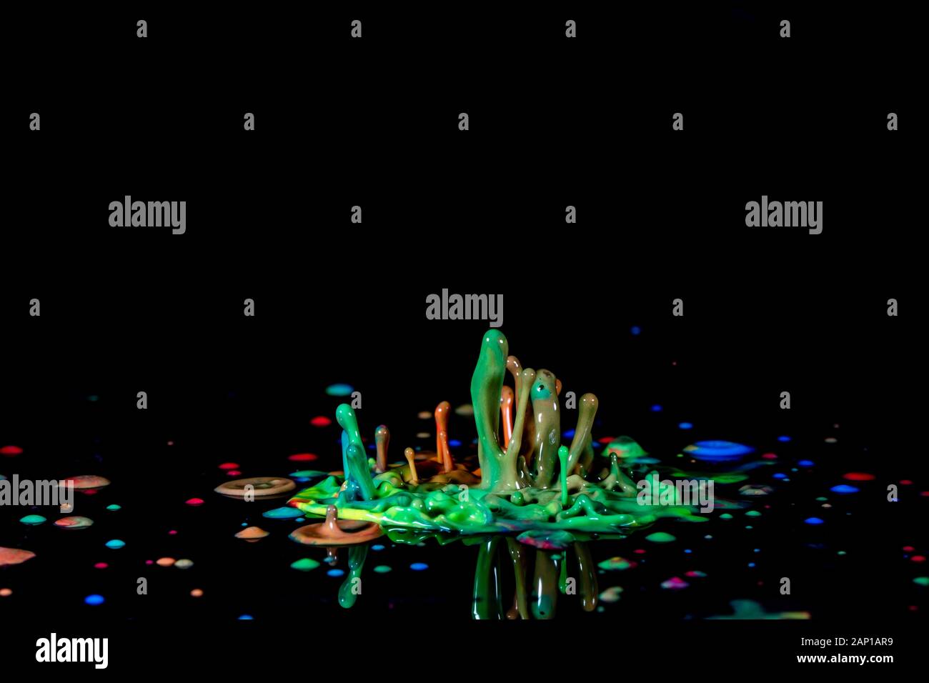 Splash of green ink on black background, abstract illustration of a ...