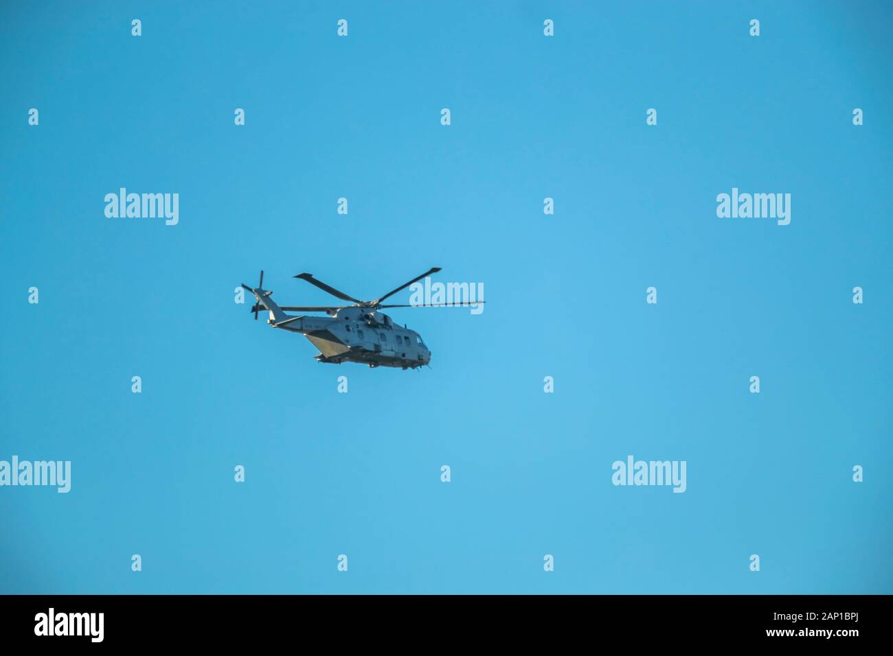 Maritime grey Merlin Mk4 helicopter in flight against a blue sky Stock ...