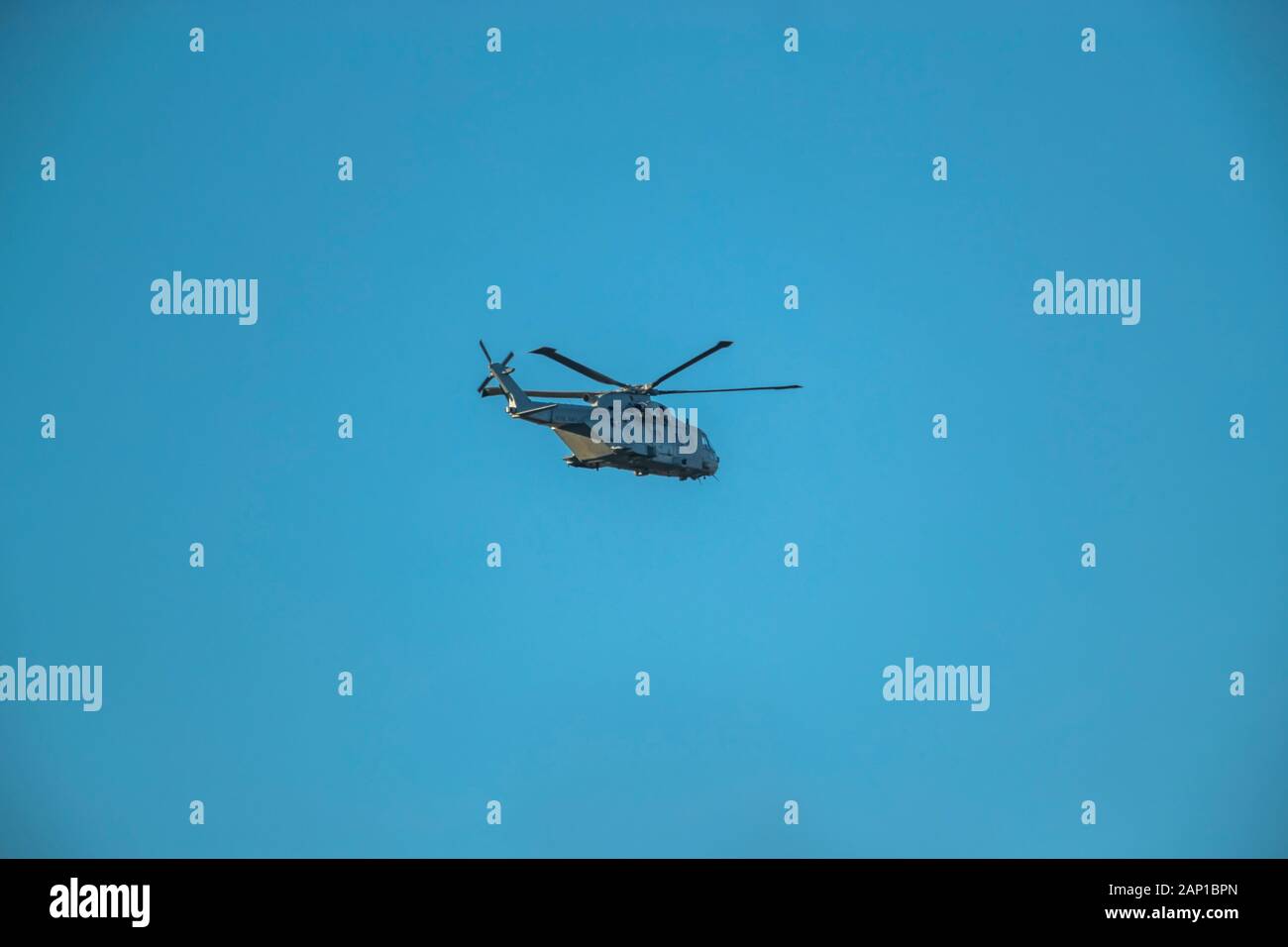 Maritime grey Merlin Mk4 helicopter in flight against a blue sky Stock ...
