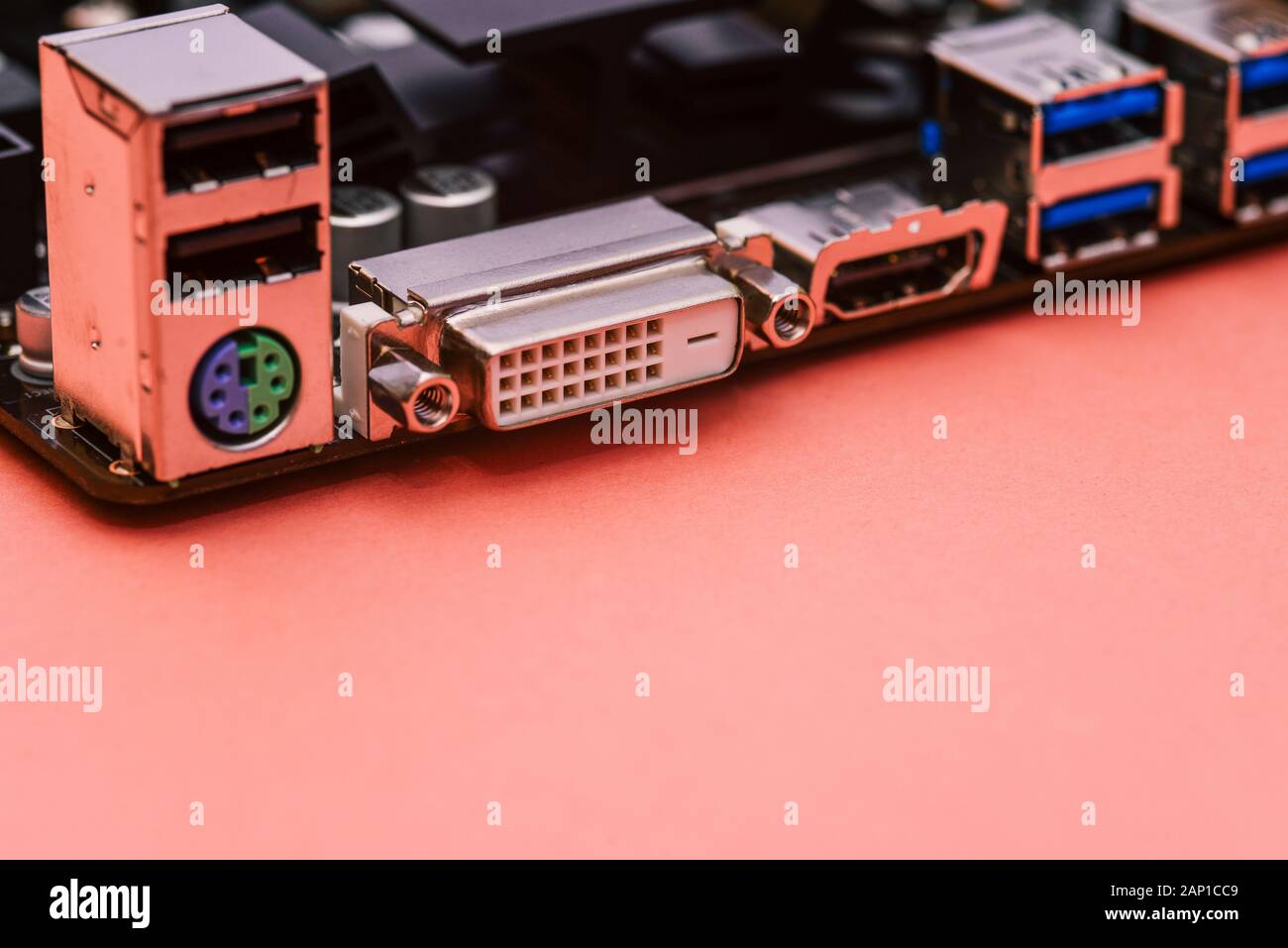 Details of a laptop computer. The back of the motherboard on a pink ...