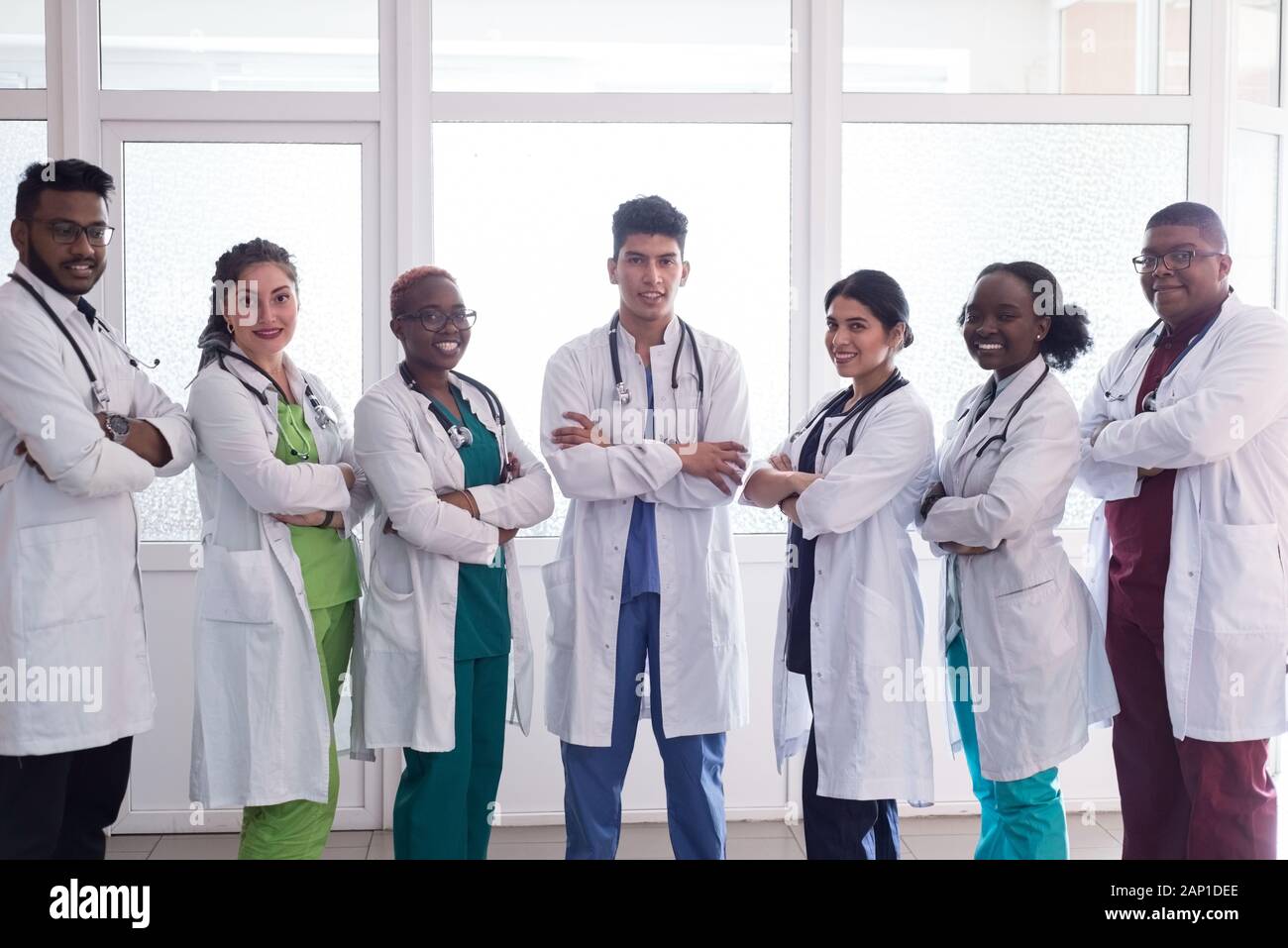 medical students, doctors, mixed race. A team of young people in white ...