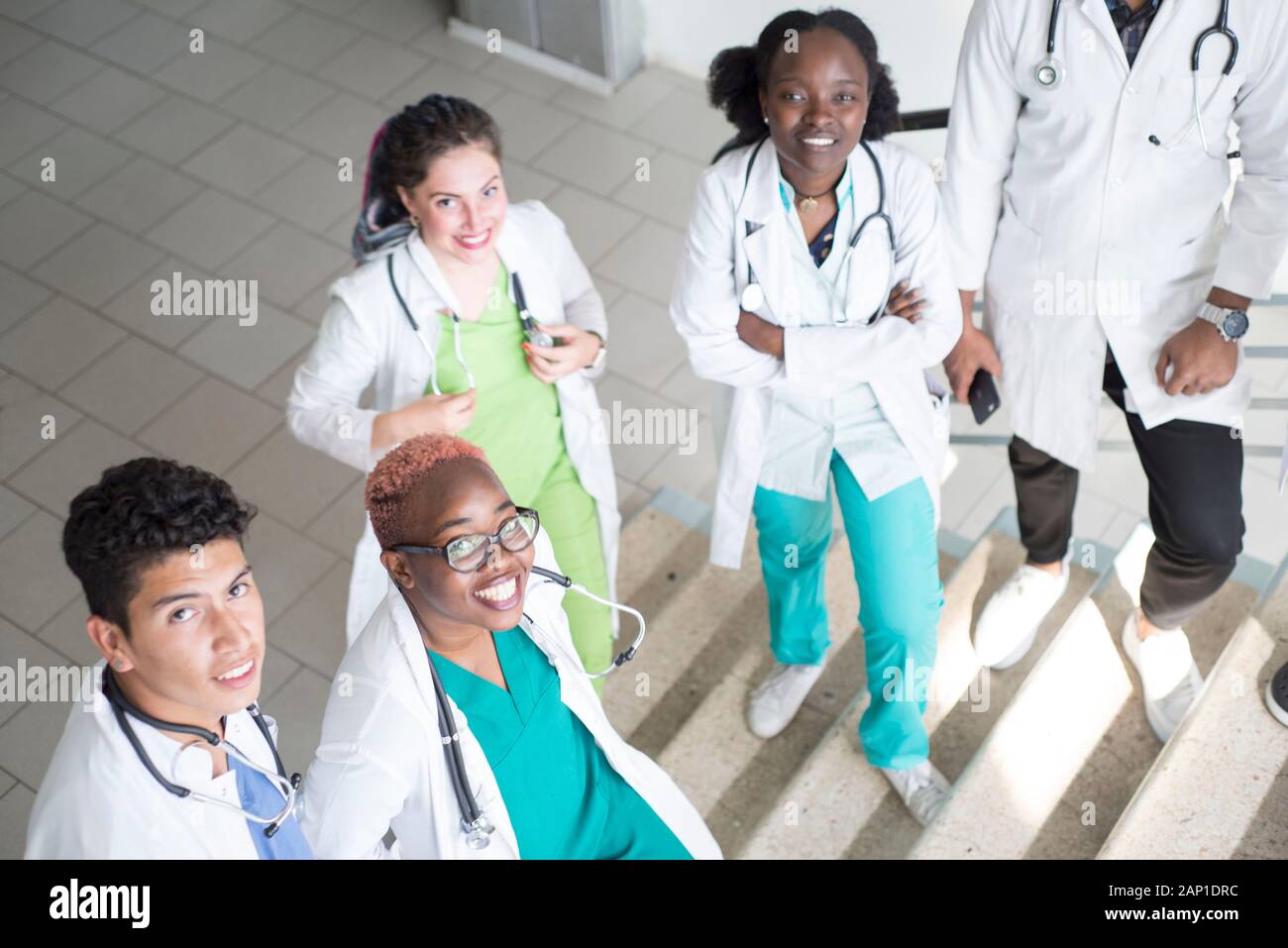 Group of colleagues sitting on steps hi-res stock photography and ...