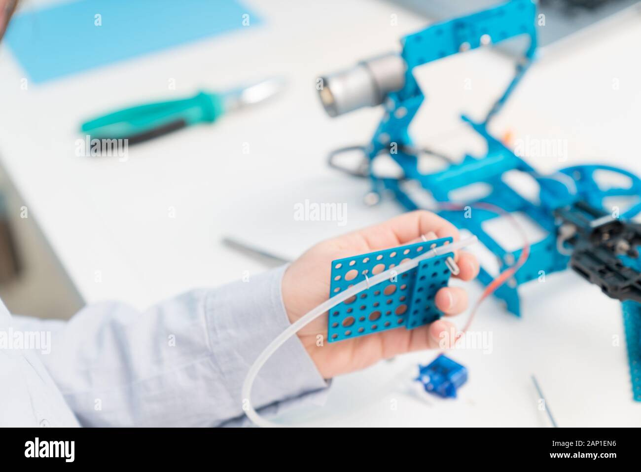 Student woman in robotics laboratory working on project mechatronics ...