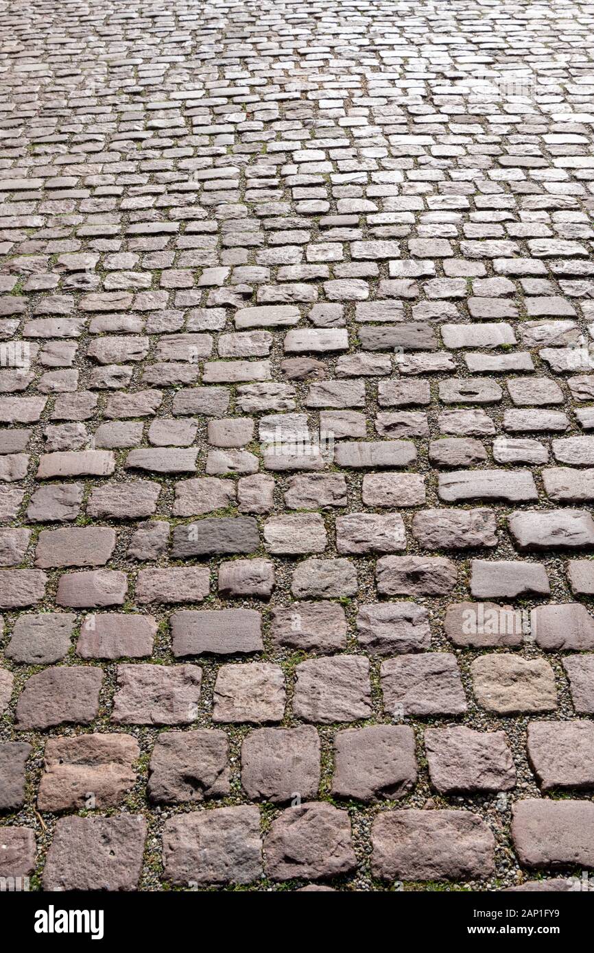 Close up of cobblestones or cobbles on a cobbled street in Alsace ...
