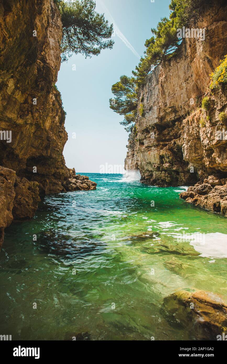 view of sea bay between rocks Stock Photo - Alamy