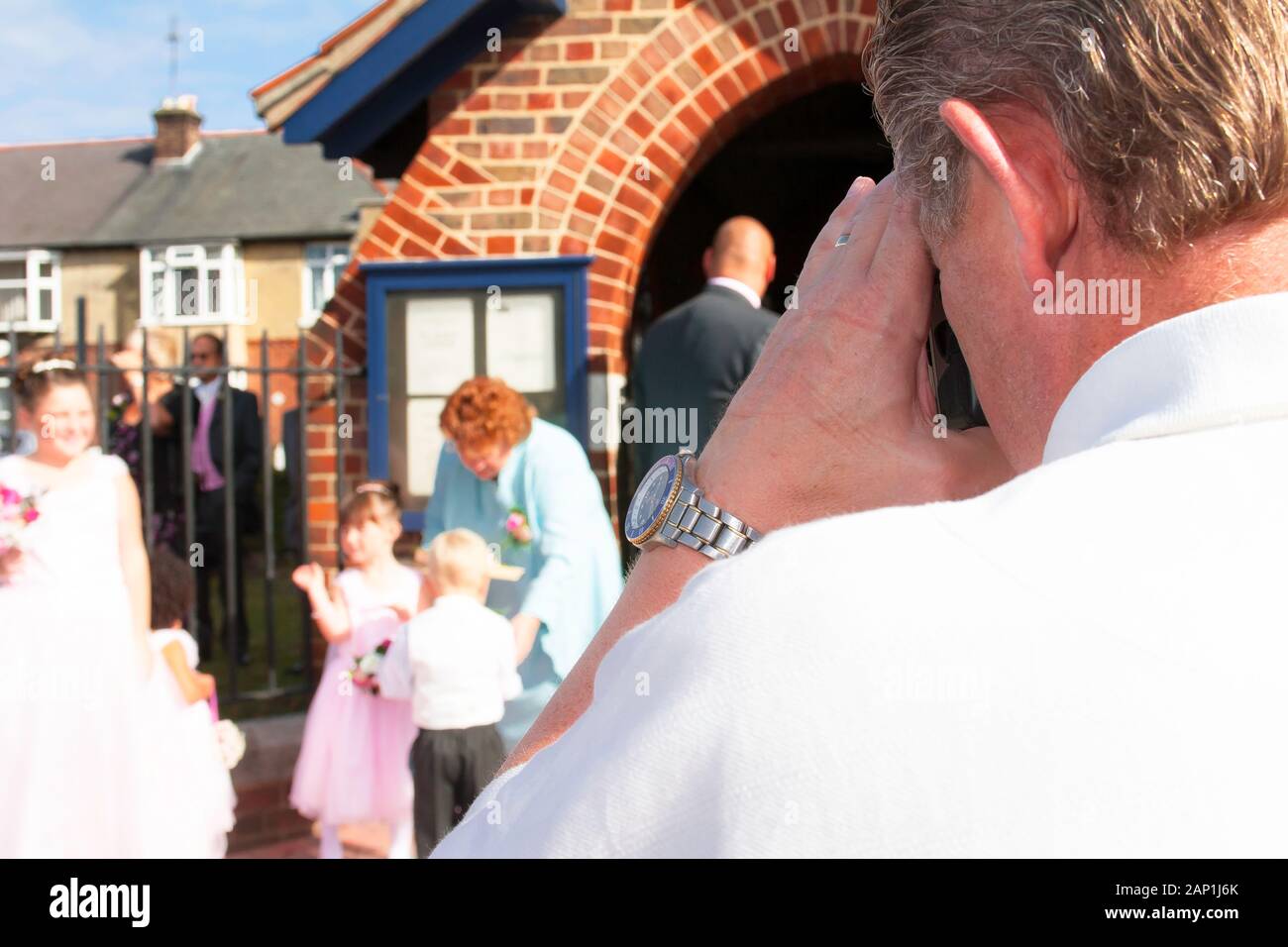 Man took the camera to family at wedding day Stock Photo - Alamy