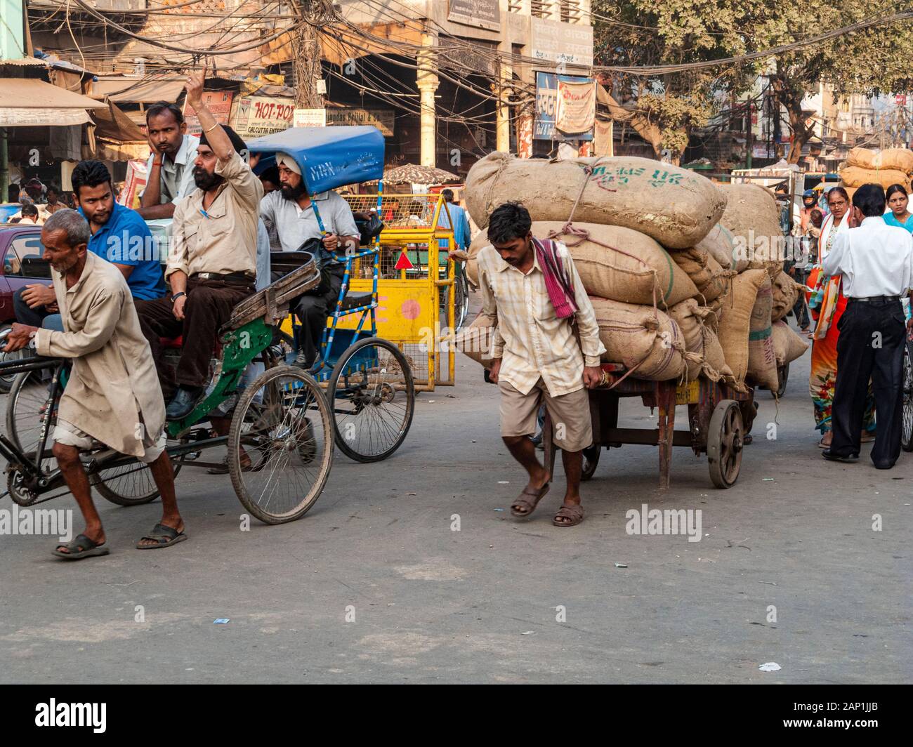 Hand pulling rickshaw puller pulling hi-res stock photography and ...