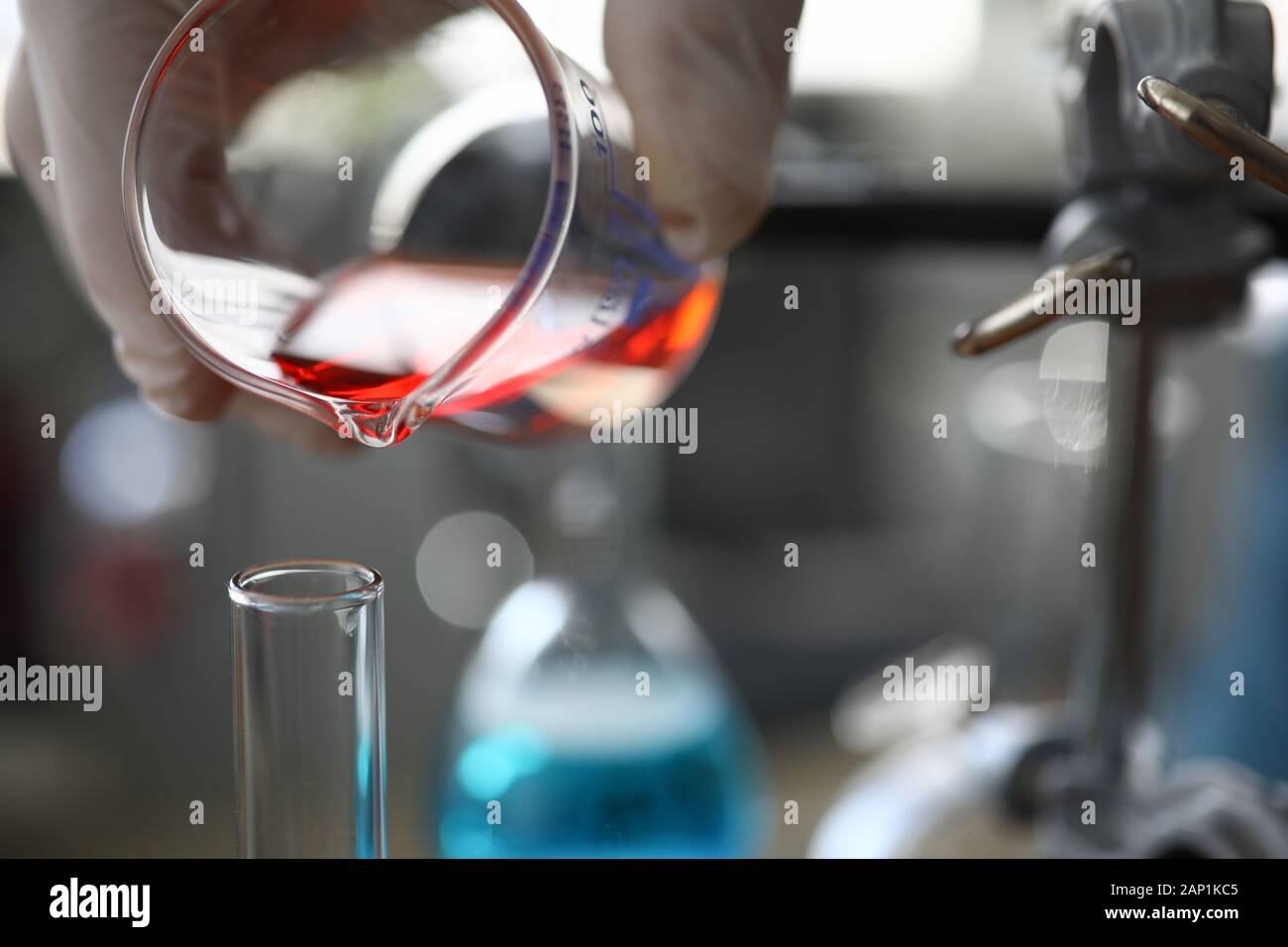 Scientist mixing reagent in test tube Stock Photo - Alamy
