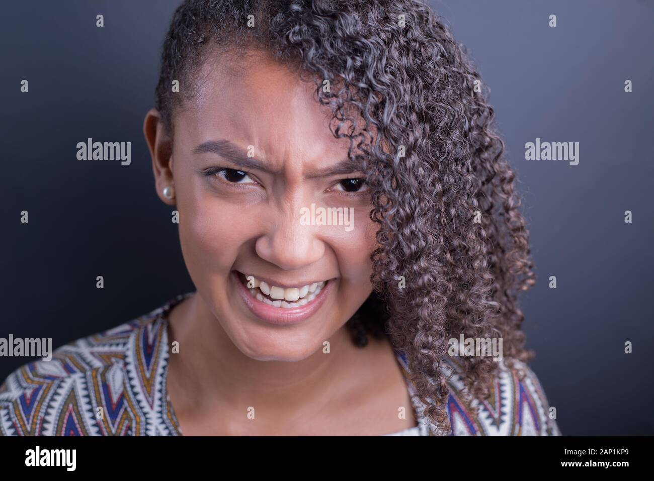 Screaming, hate, rage. Crying emotional angry woman screaming on blue ...