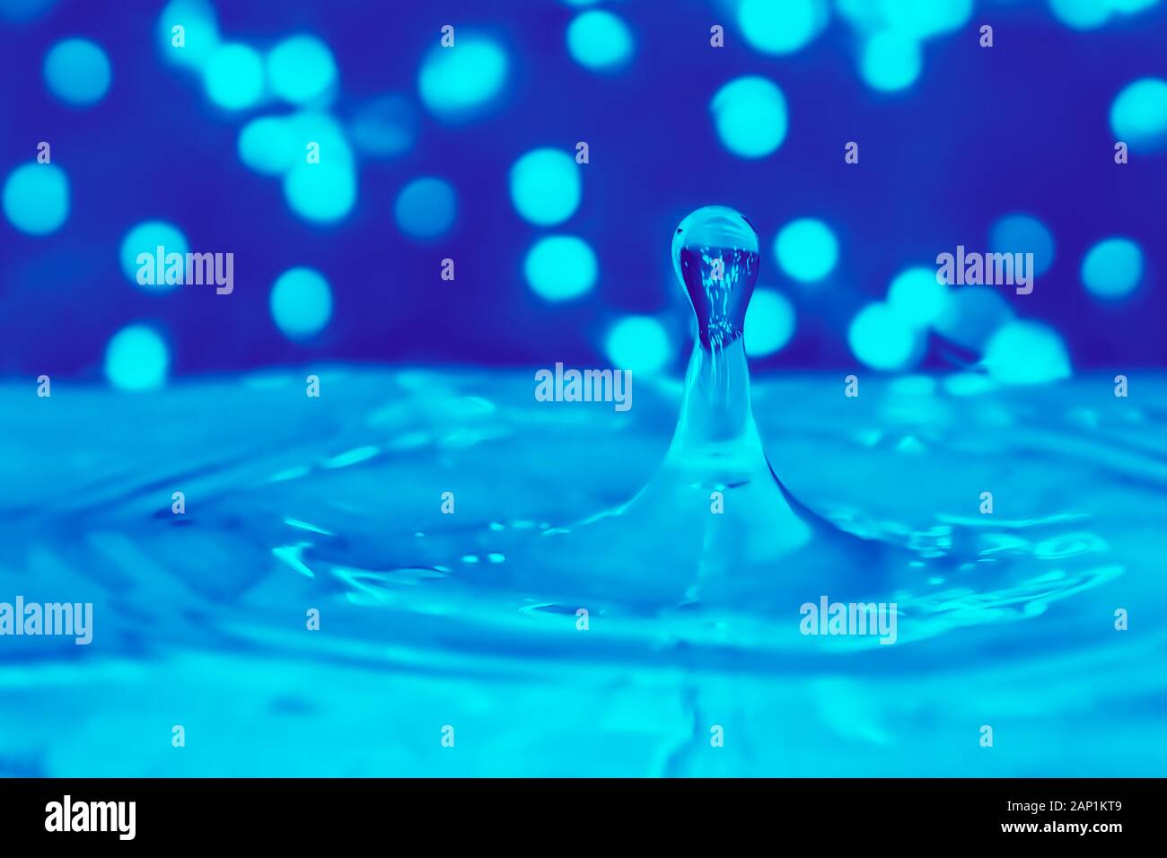 water drop splash classic blue colored. lights Stock Photo - Alamy