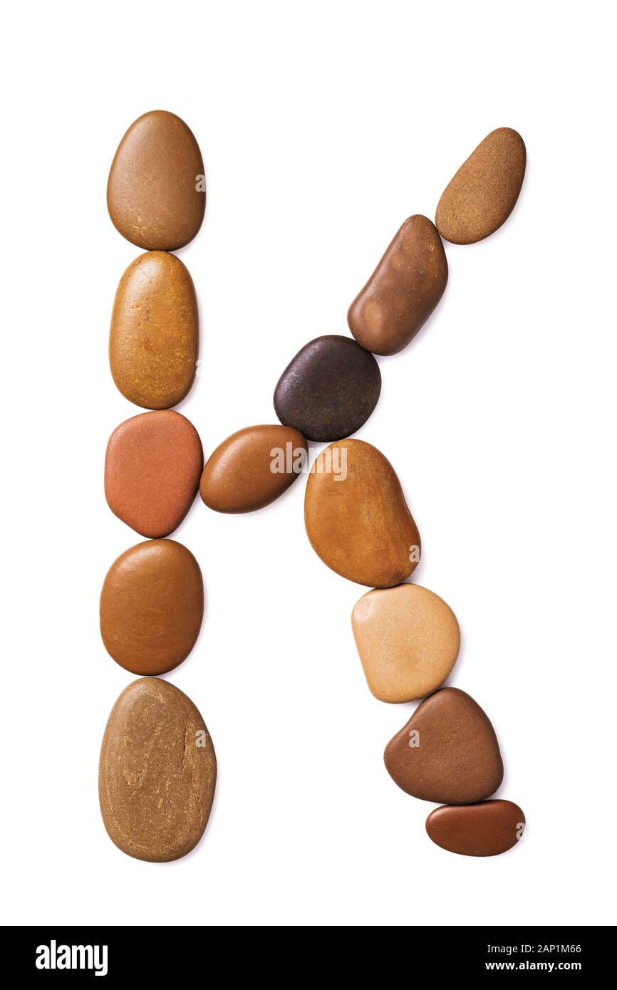 Letter K made of marine small pebbles, top view. Alphabet made of ...