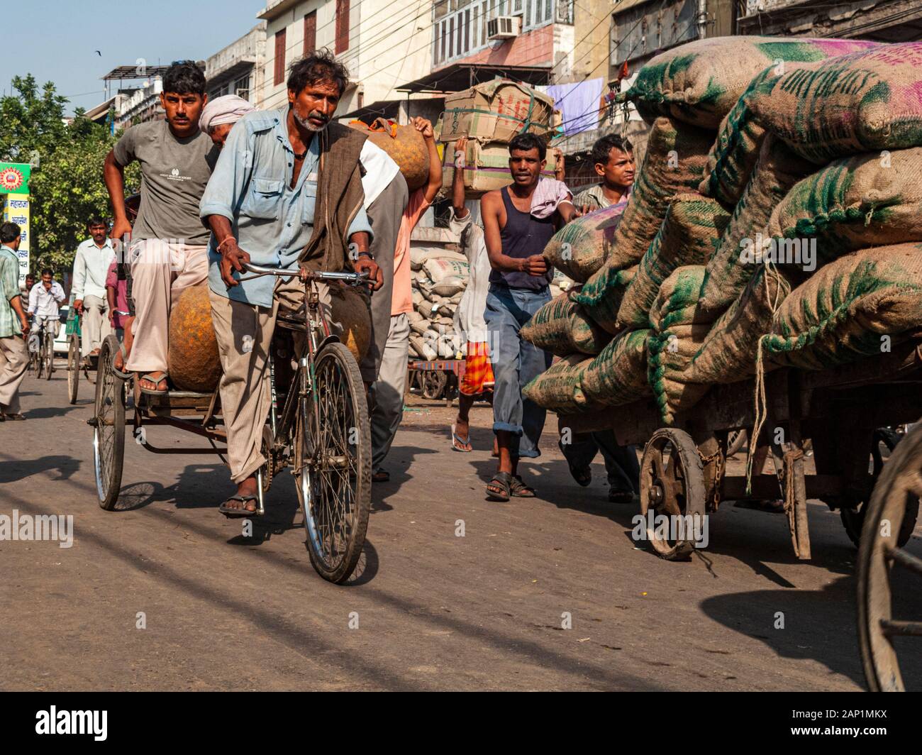 Hand pulling rickshaw puller pulling hi-res stock photography and ...
