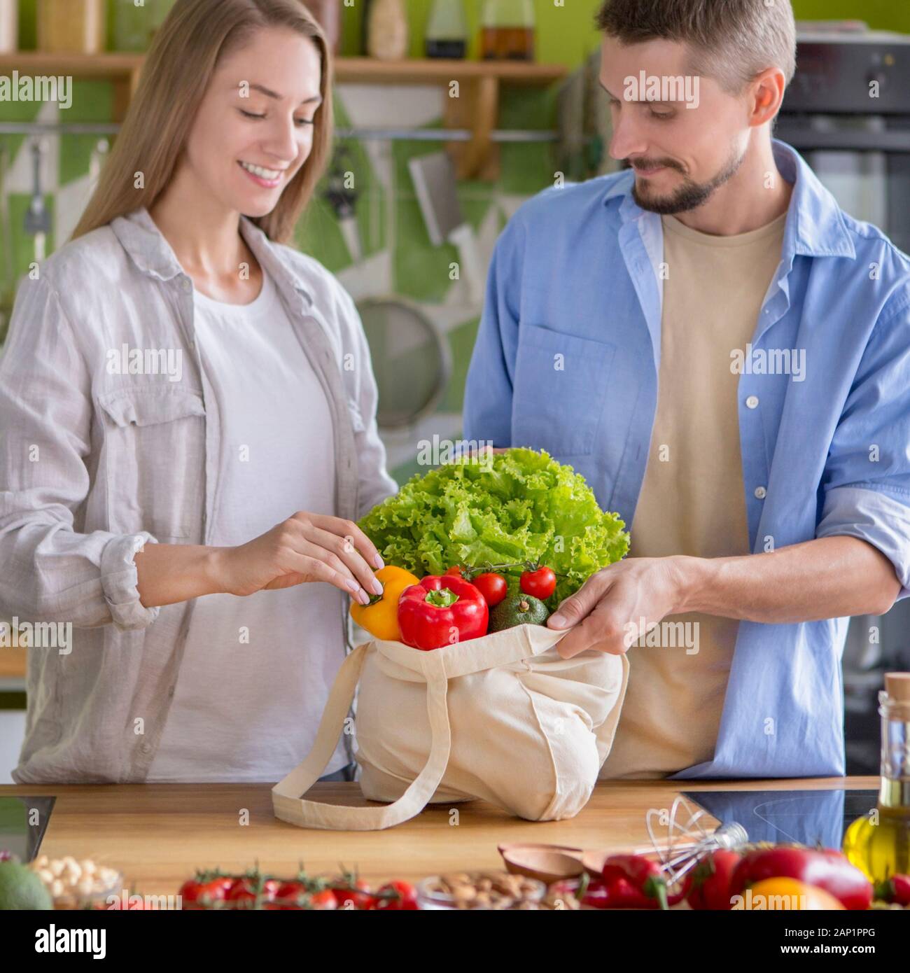 Just married couple cooking healthy and tasty food Stock Photo - Alamy