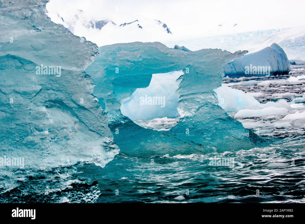 Blue ice of a glacier in Antarctica. The ice of blue icebergs contains ...