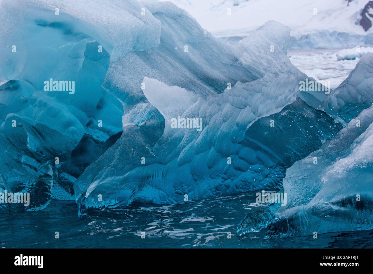 Blue ice of a glacier in Antarctica. The ice of blue icebergs contains ...