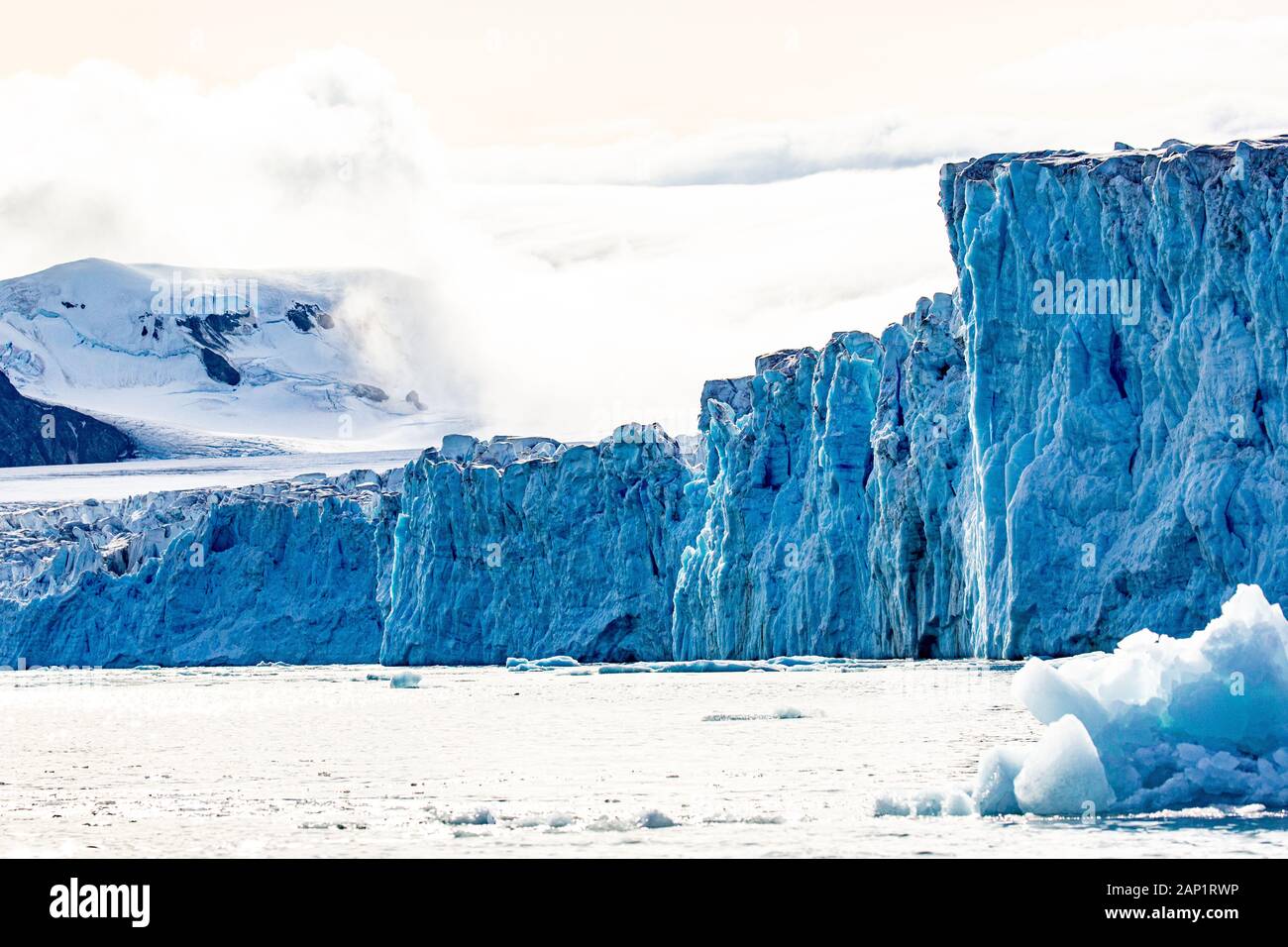 Blue ice of a glacier in Antarctica. The ice of blue icebergs contains ...