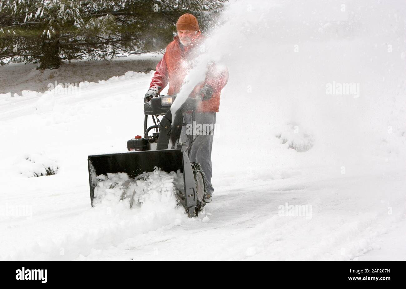 Man using snow blower hi-res stock photography and images - Alamy