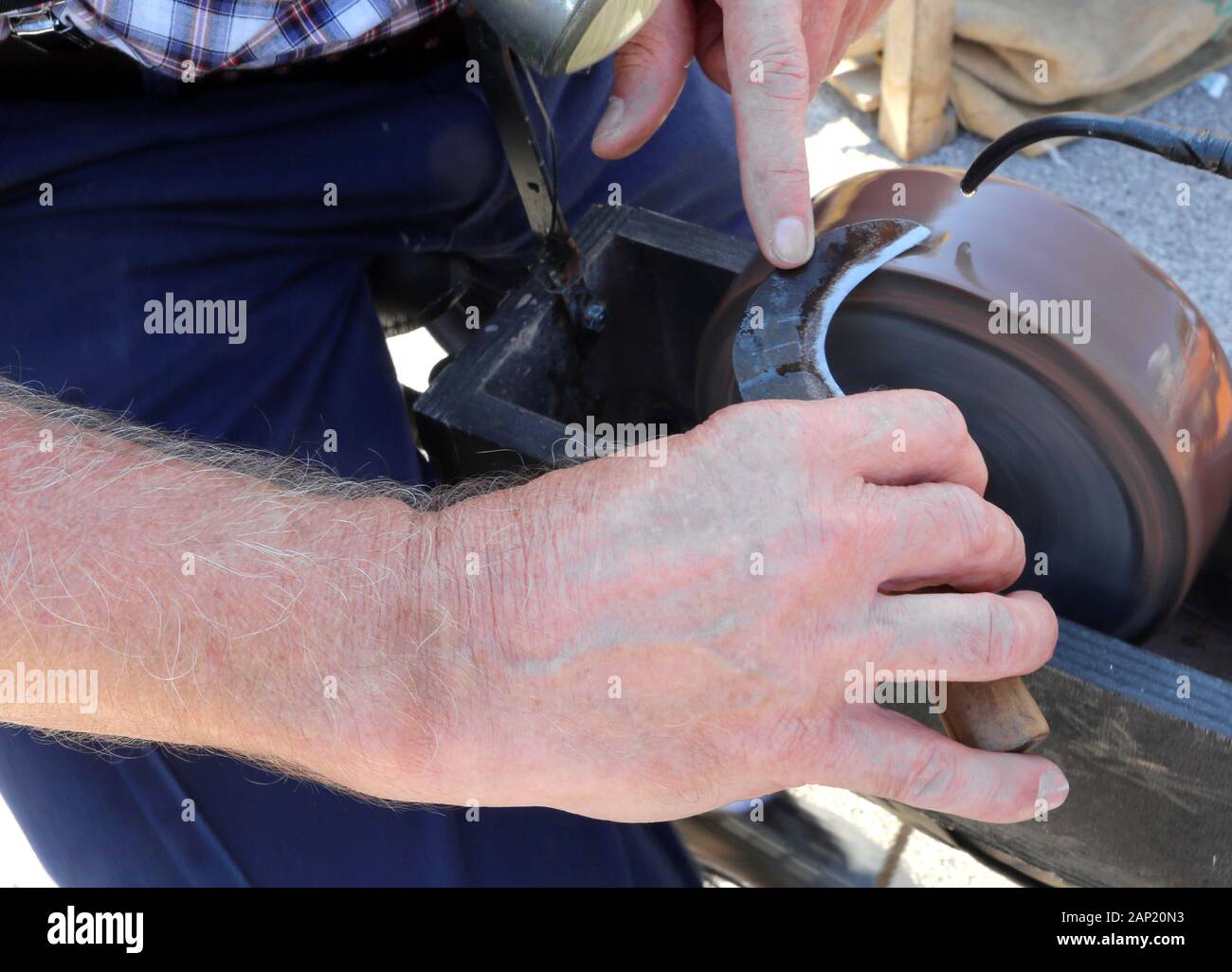 Person sharpens knife using sharpening hi-res stock photography and ...