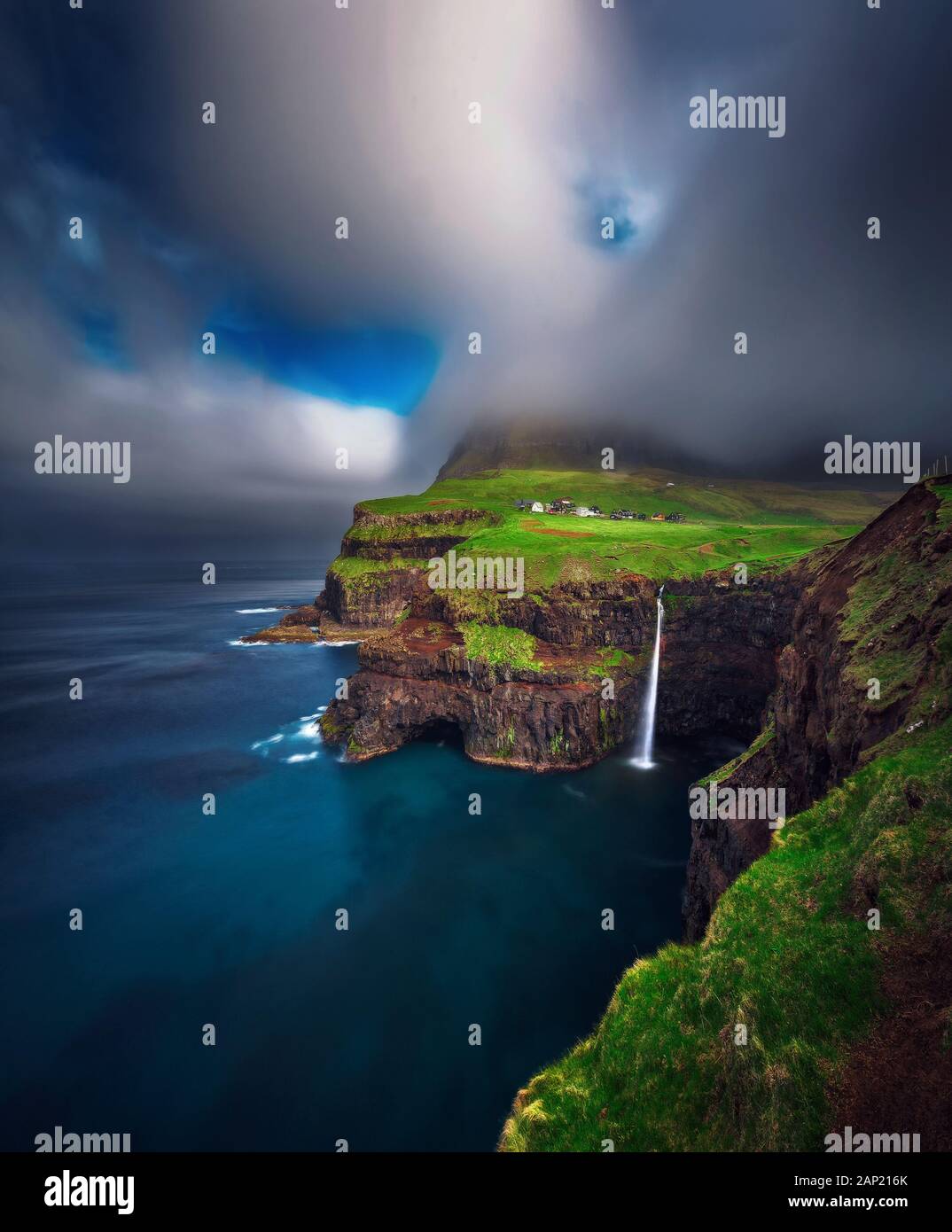 Gasadalur village and Mulafossur waterfall on Faroe Islands, Denmark ...