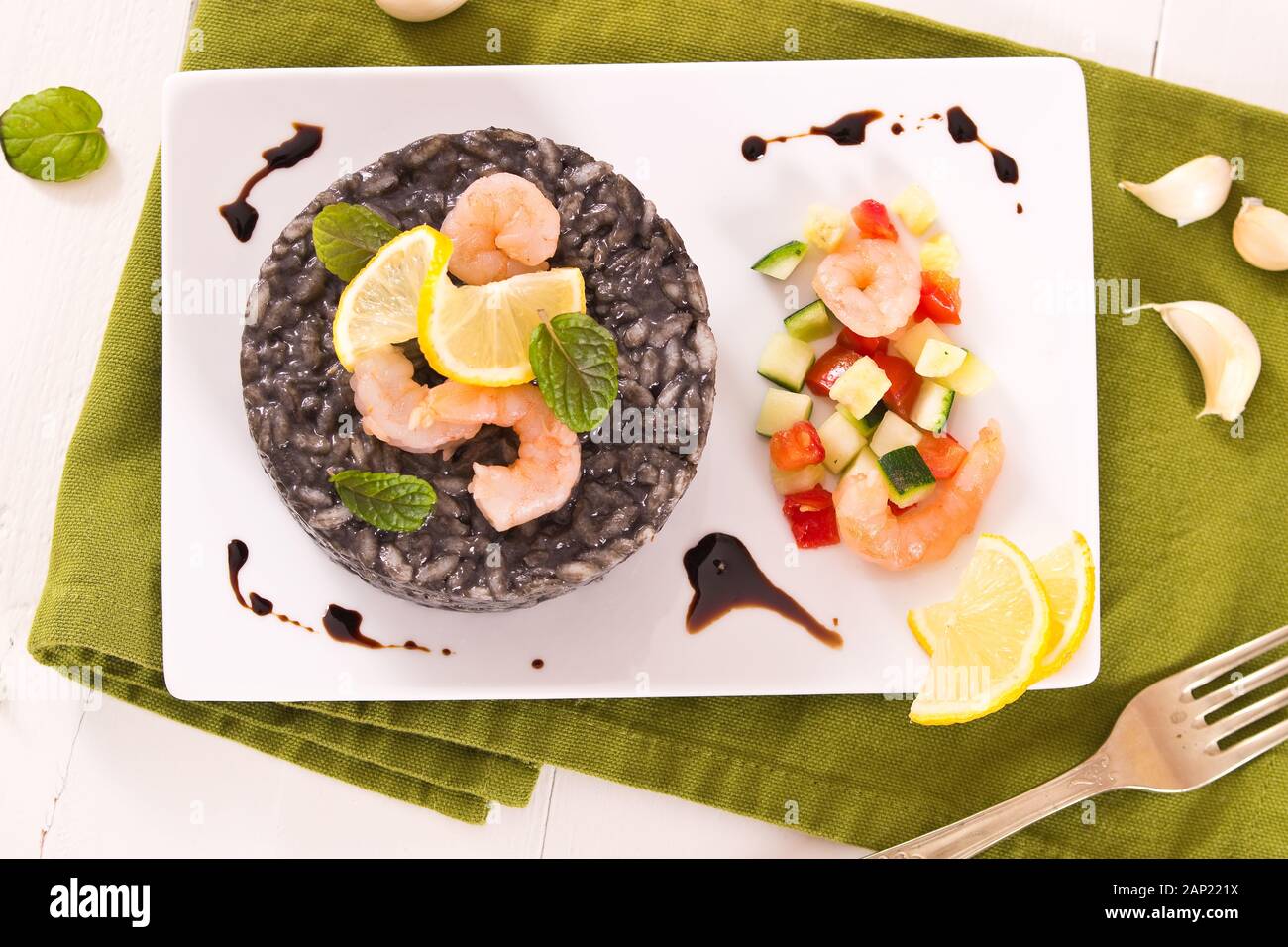 Squid ink risotto Stock Photo - Alamy