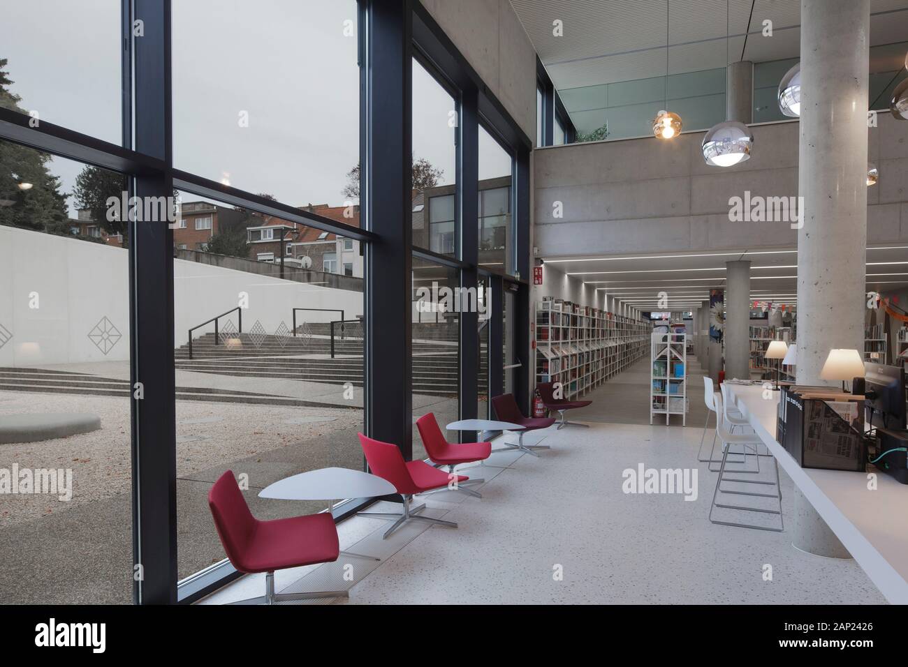 Seating in library foyer, with large windows to entrance courtyard ...