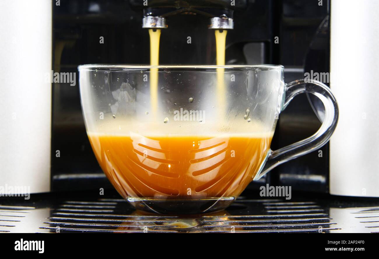 View on modern automatic coffee maker machine with isolated transparent ...