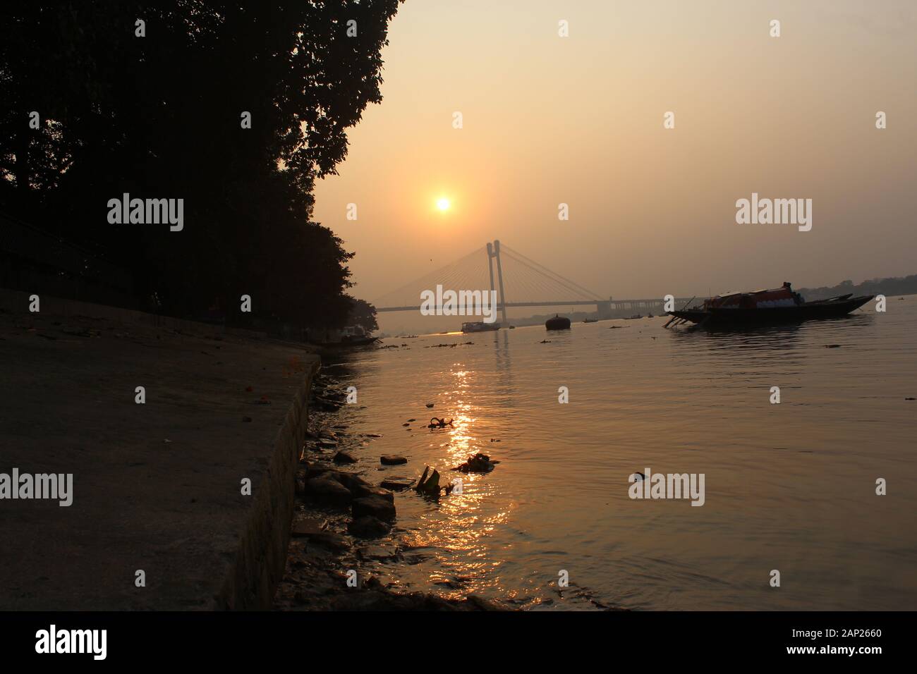 sun setting , ganga, west bengal, india Stock Photo - Alamy
