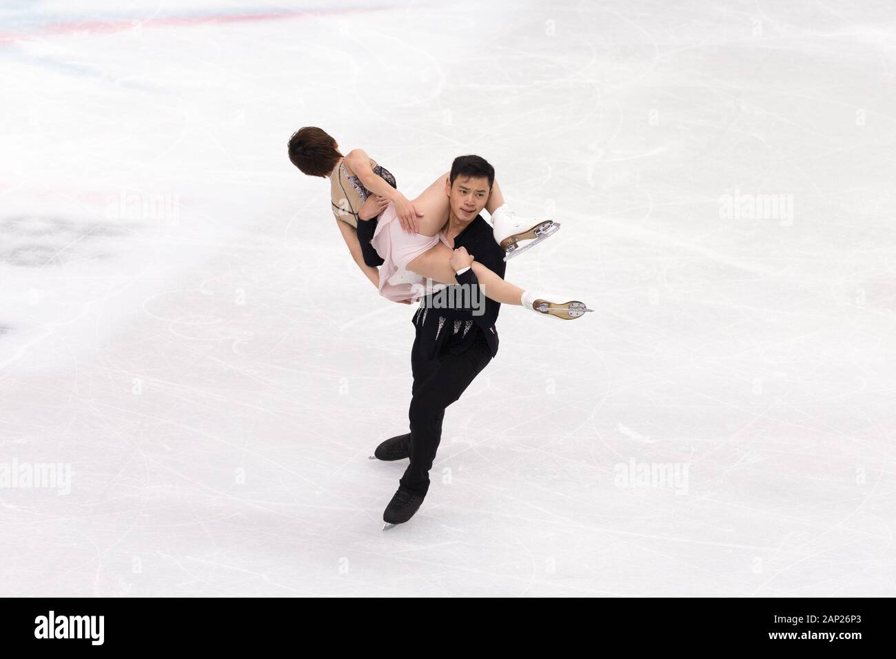 Cheng Peng and Yang Jin of China compete during senior pairs short ...