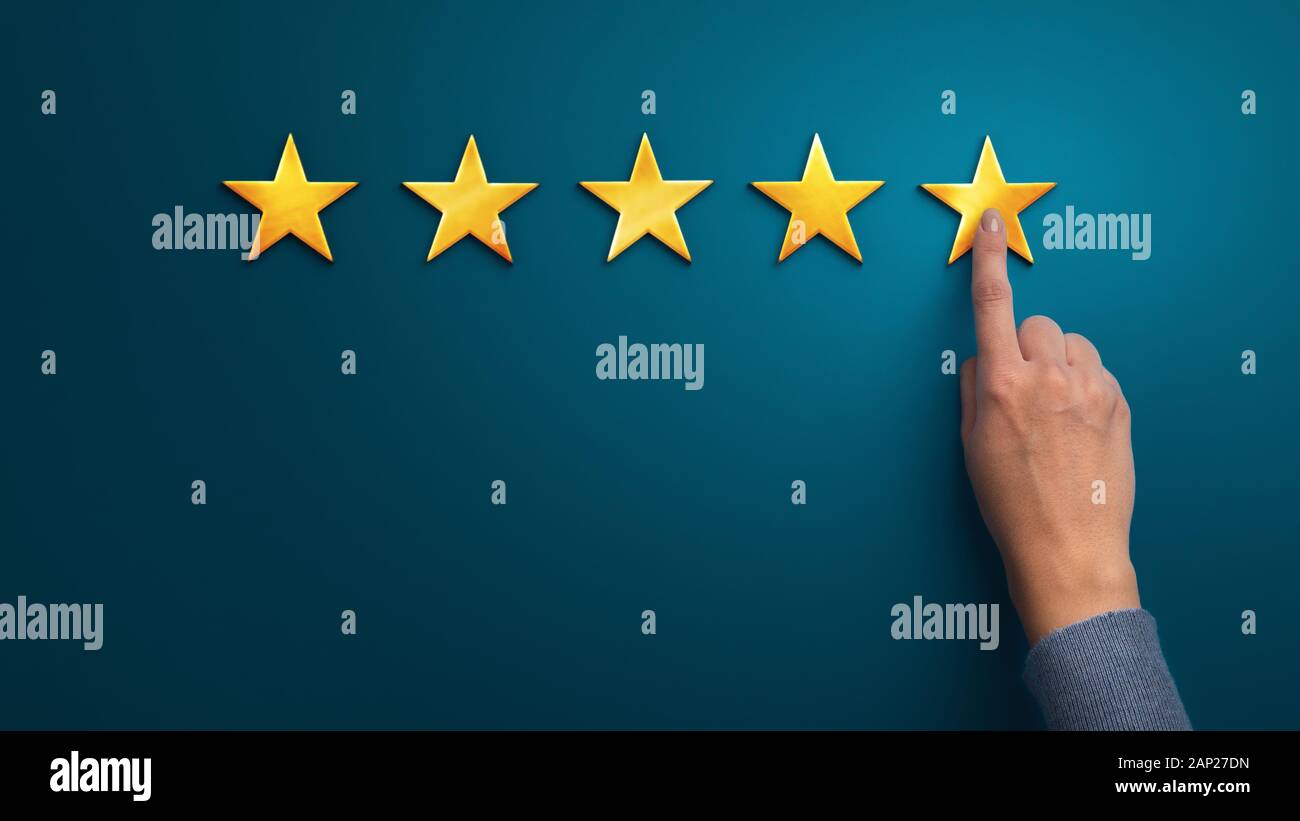 Hand of client giving a five star rating on blue background Stock Photo ...