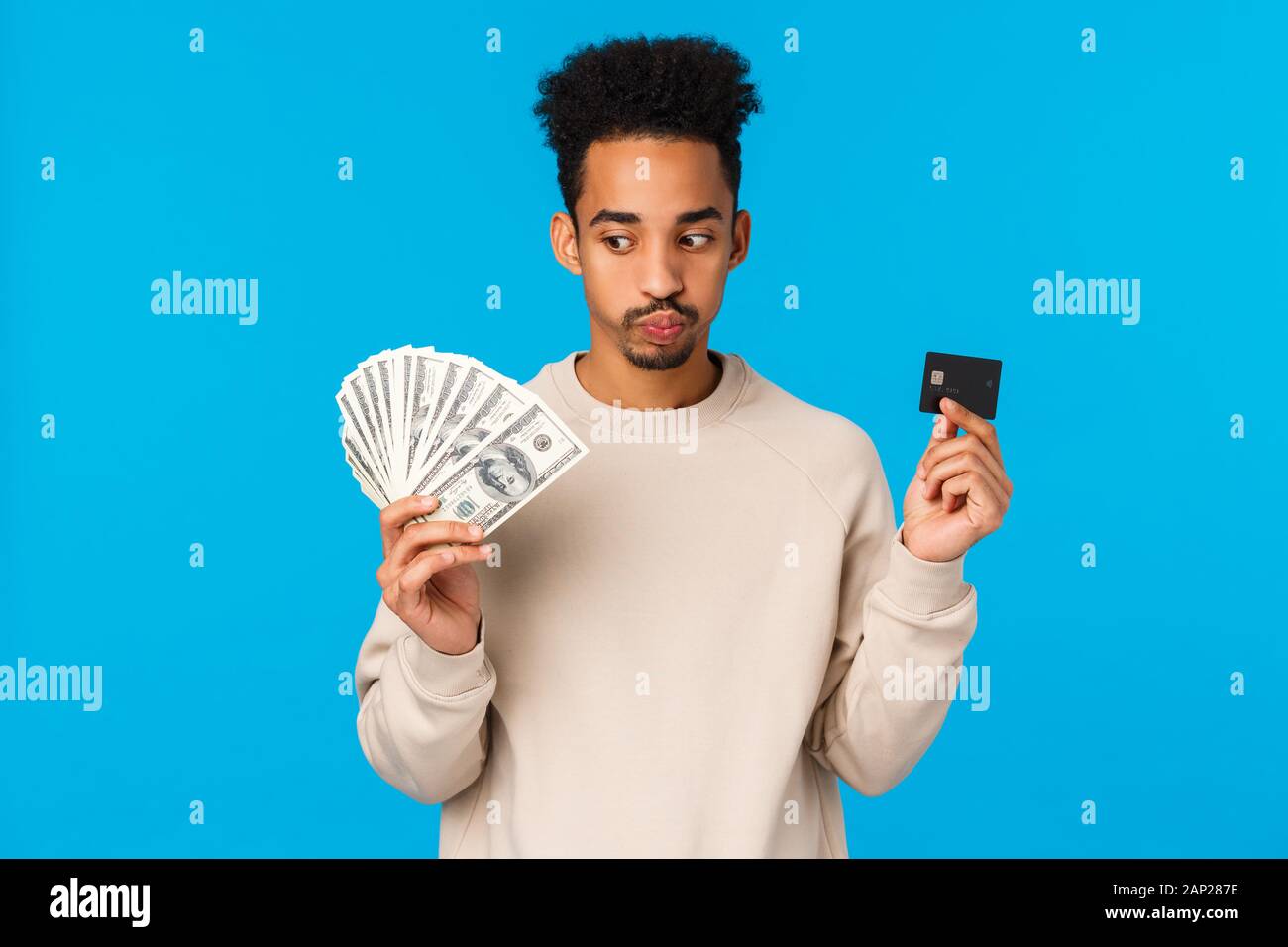 Indecisive and troubled young african-american guy facing tough ...