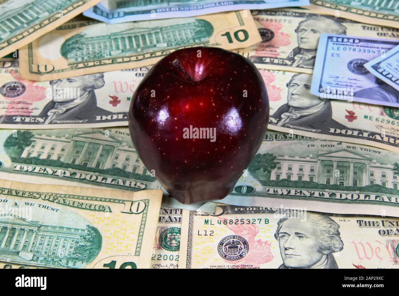 Healthy nutrition cost expenditure concept: Isolated red shiny apple ...