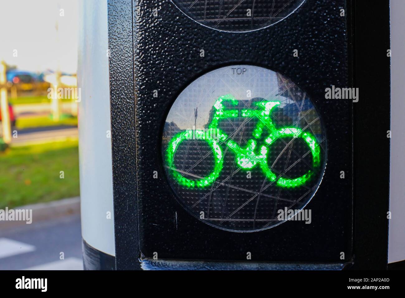 View on traffic signal at pedestrian crossing with green bicycle sign ...