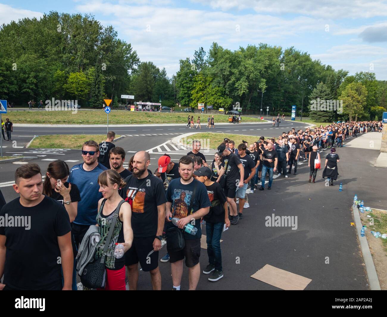 Visitors are waiting in line before the concert to enter the stadium ...