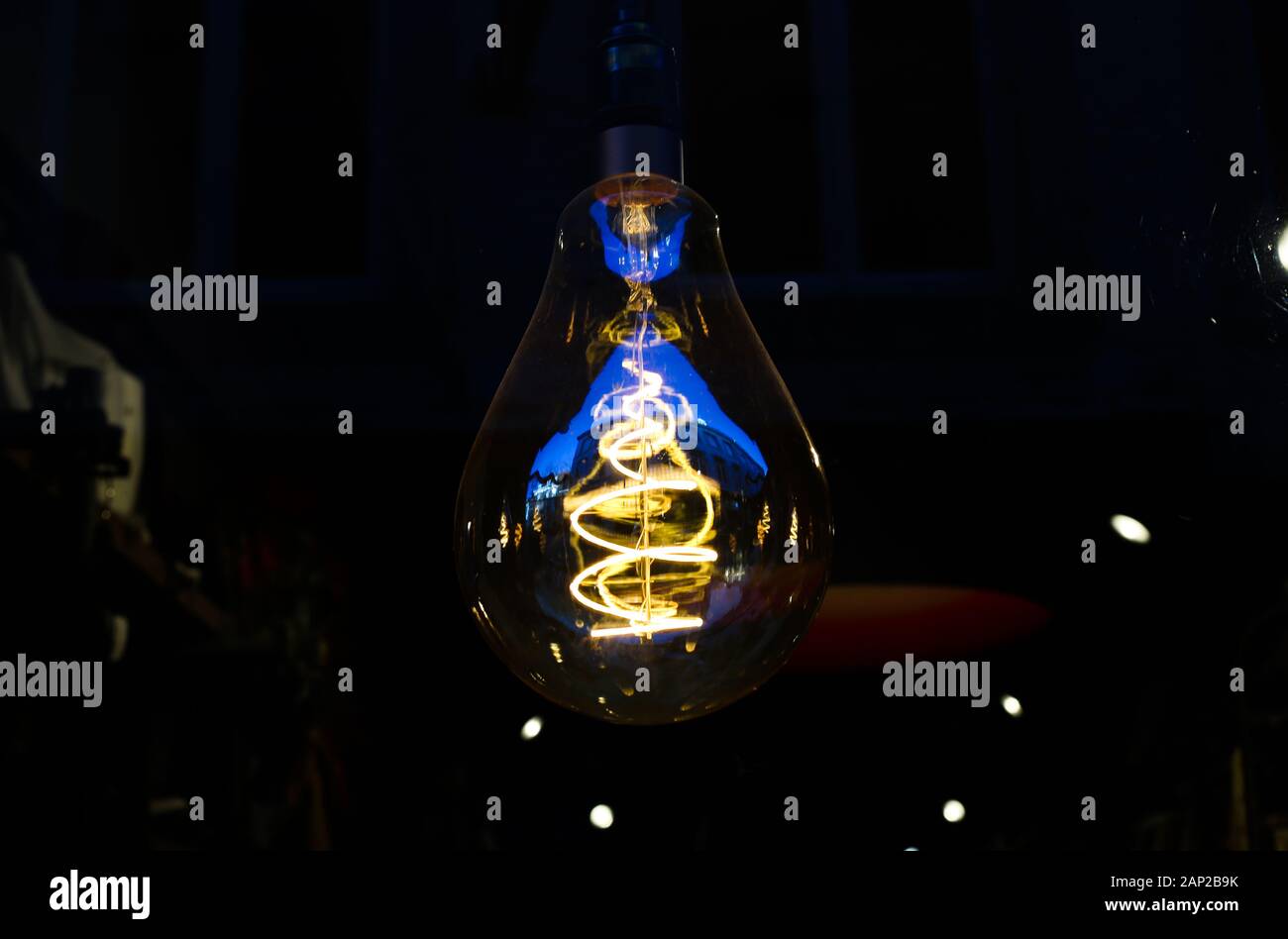 View through shop display window with isolated hanging retro burning ...