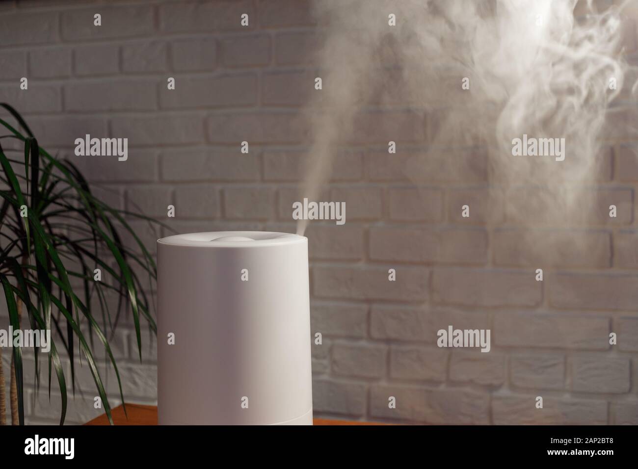 Humidifier spreading steam into the living room Stock Photo - Alamy