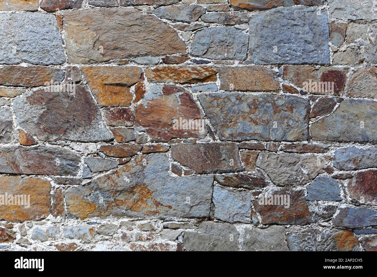 Medieval stone wall made from granite Stock Photo - Alamy
