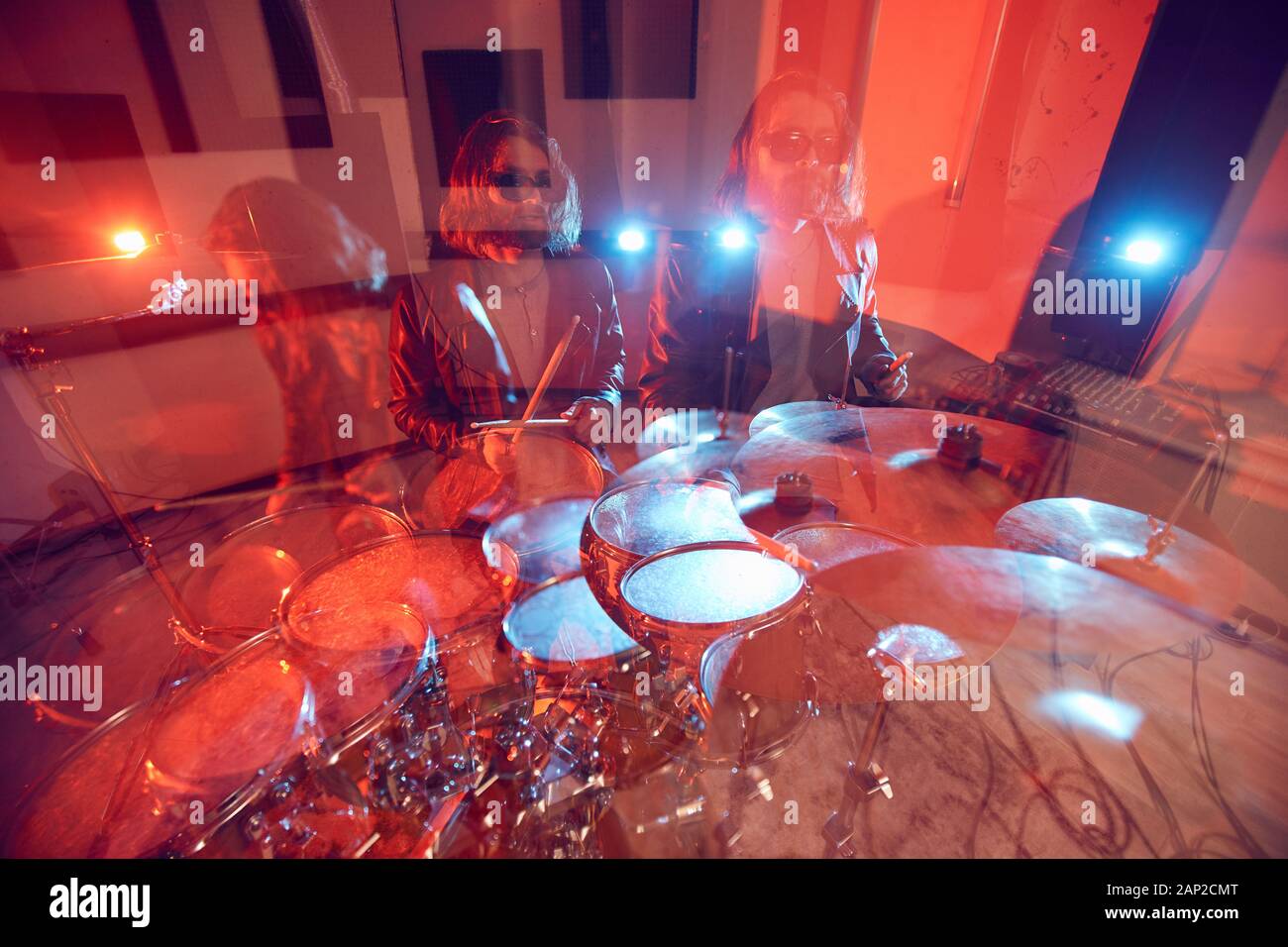 Triple image of handsome long-haired man rocking drums at music concert ...