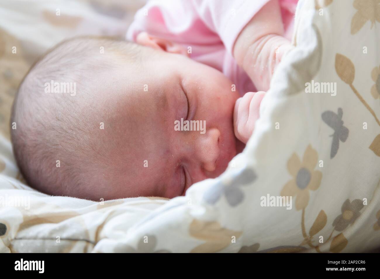 Sleeping newborn baby. Cute little girl one week old. Adorable lying on ...