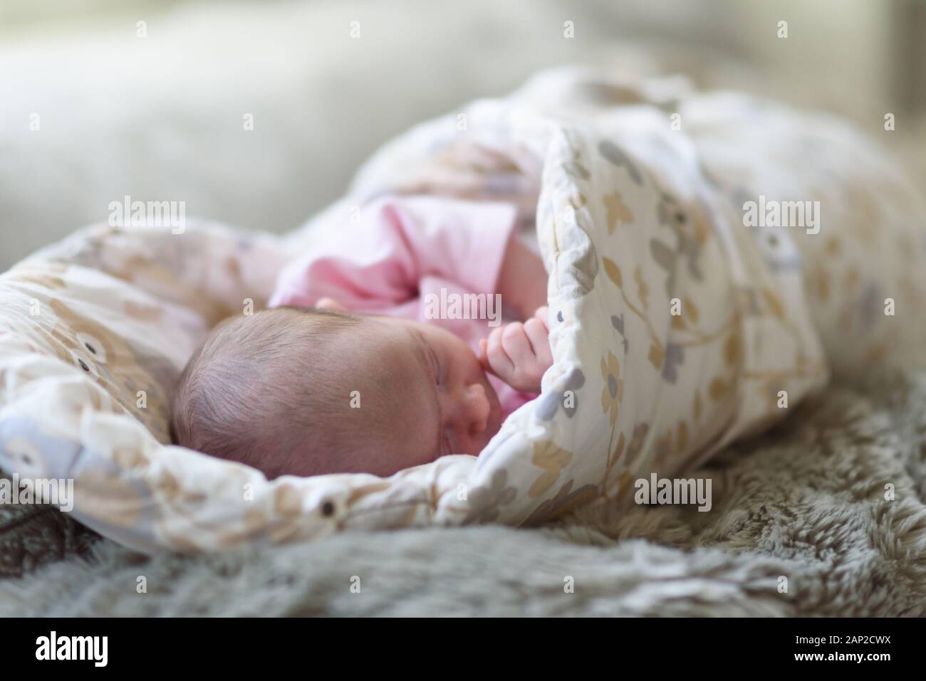 Sleeping newborn baby. Cute little girl one week old. Adorable lying on ...