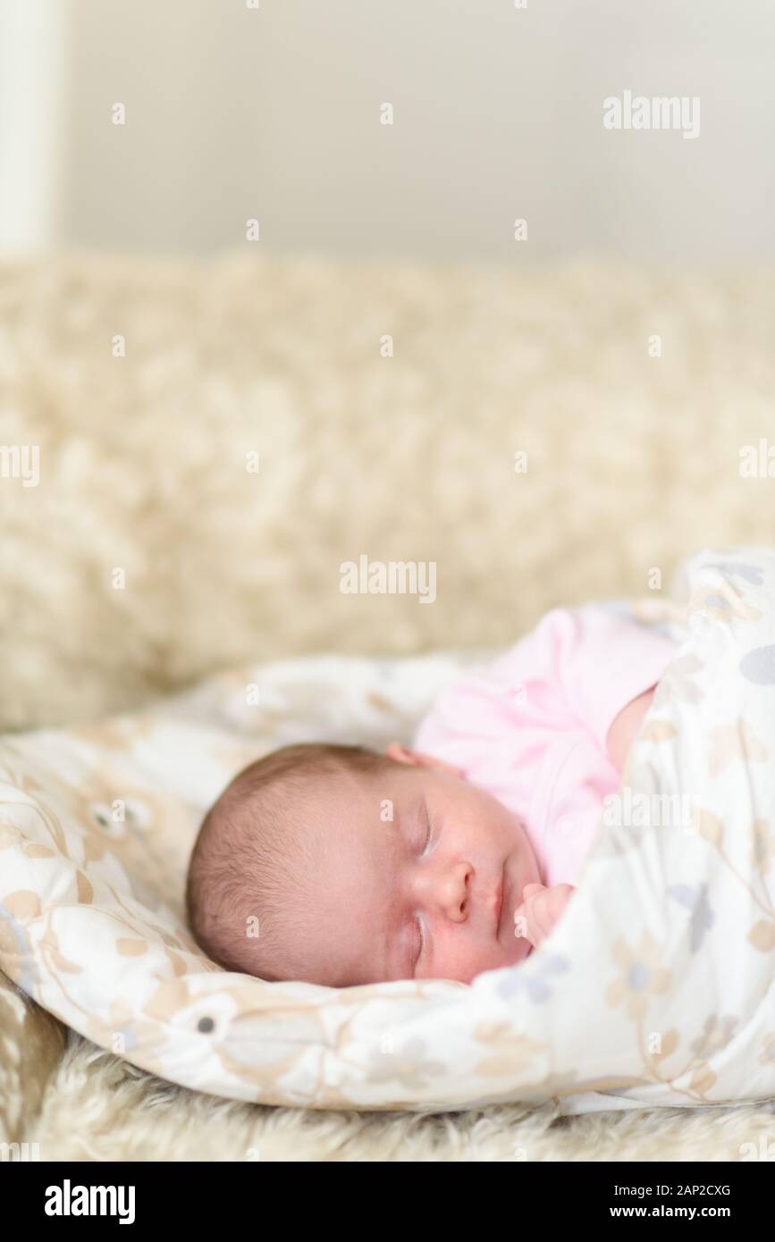 Sleeping newborn baby. Cute little girl one week old. Adorable lying on ...