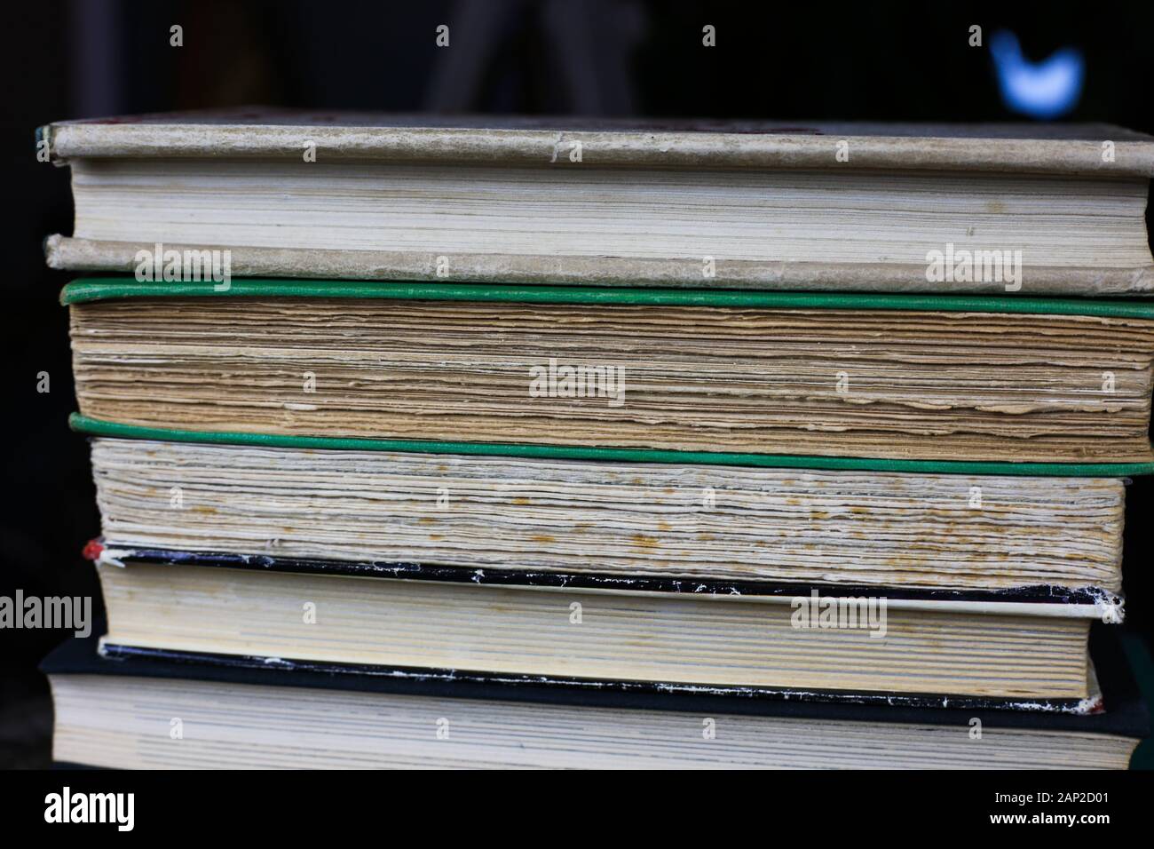 View on isolated pile of antique yellowed books with edges of cover and ...