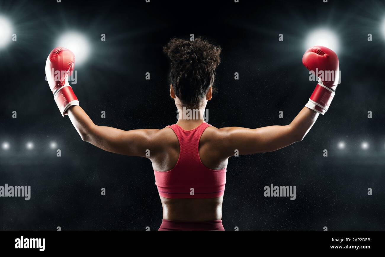 Back view of black woman boxer champion celebrating win Stock Photo - Alamy