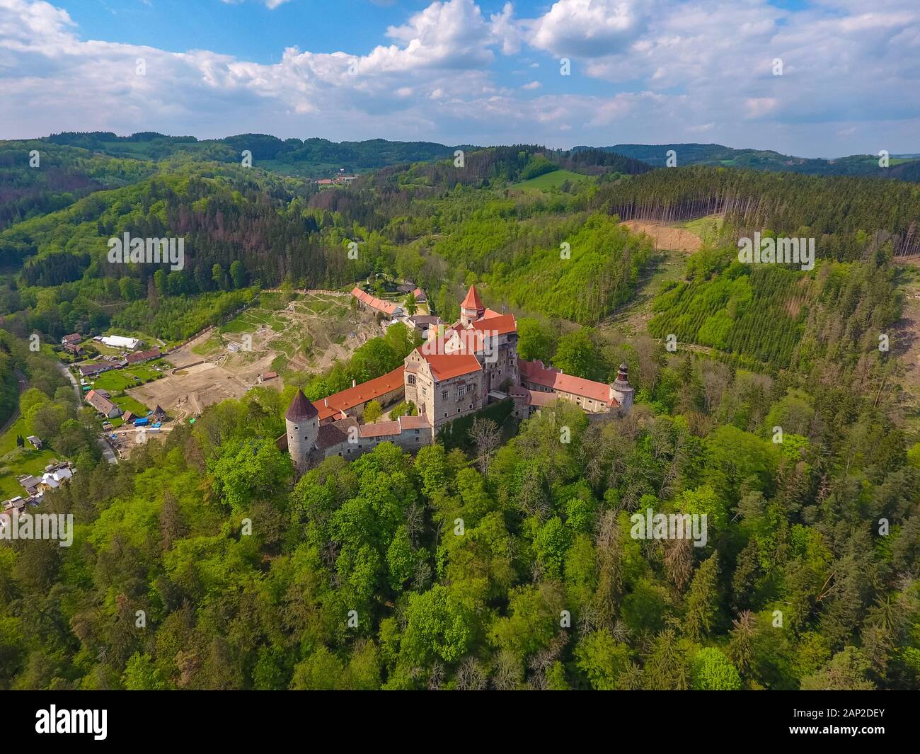 Aerial view of Moravian castle Pernstejn, standing on a hill above deep ...