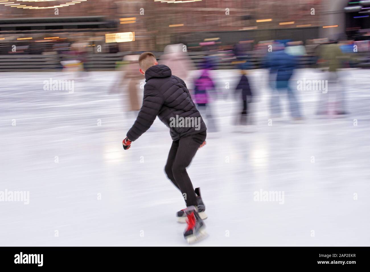 Skating on the ice rink.It's good for your health Stock Photo - Alamy