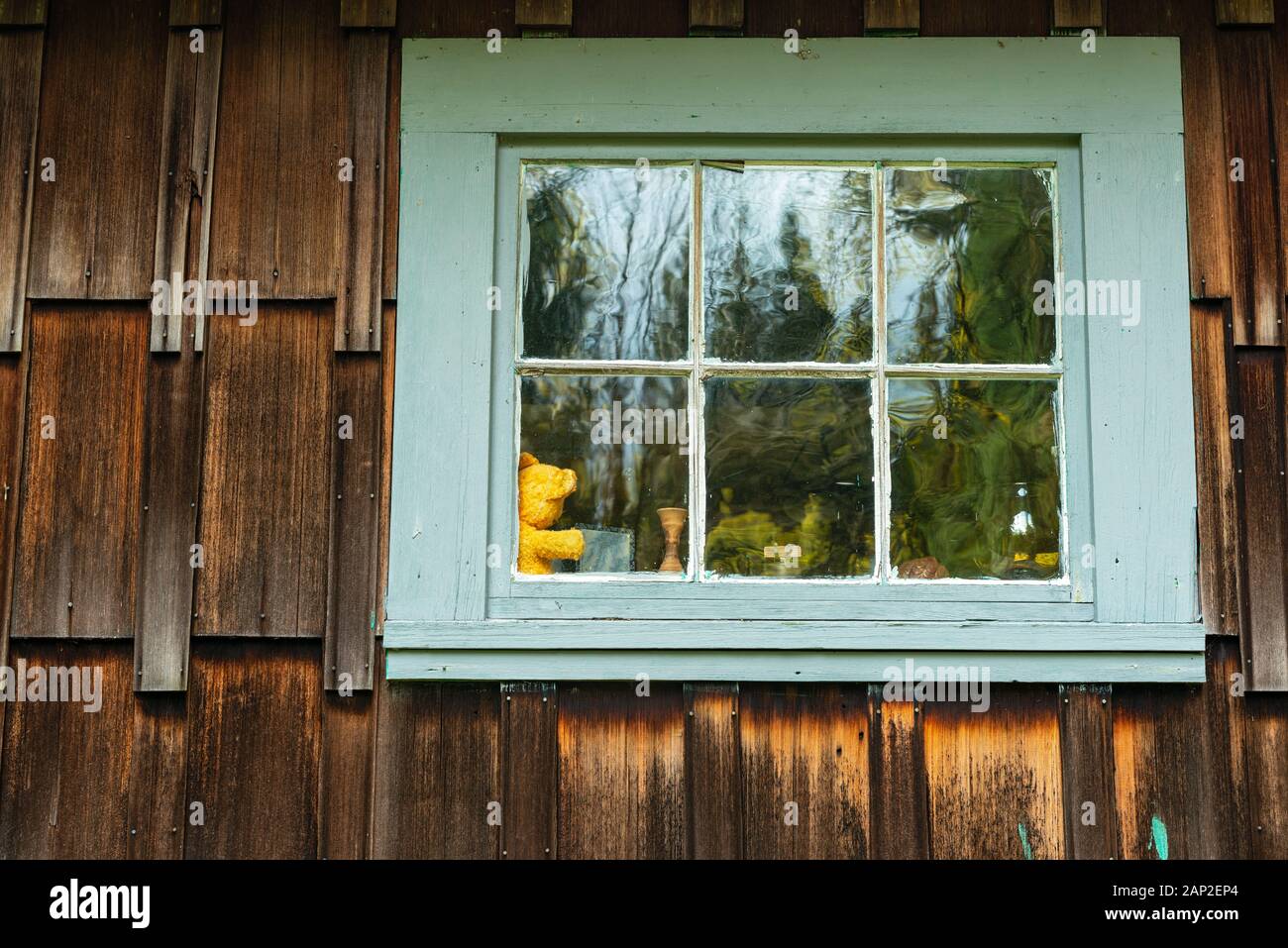 A Teddy Bear in a Cottage Window Stock Photo - Alamy