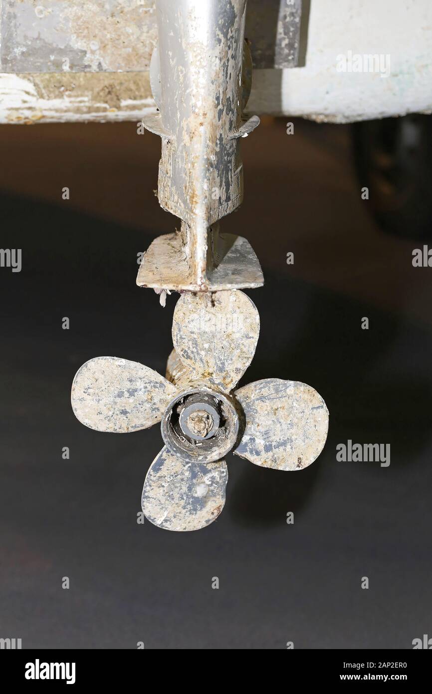 Outboard motor propeller covered with mud Stock Photo - Alamy