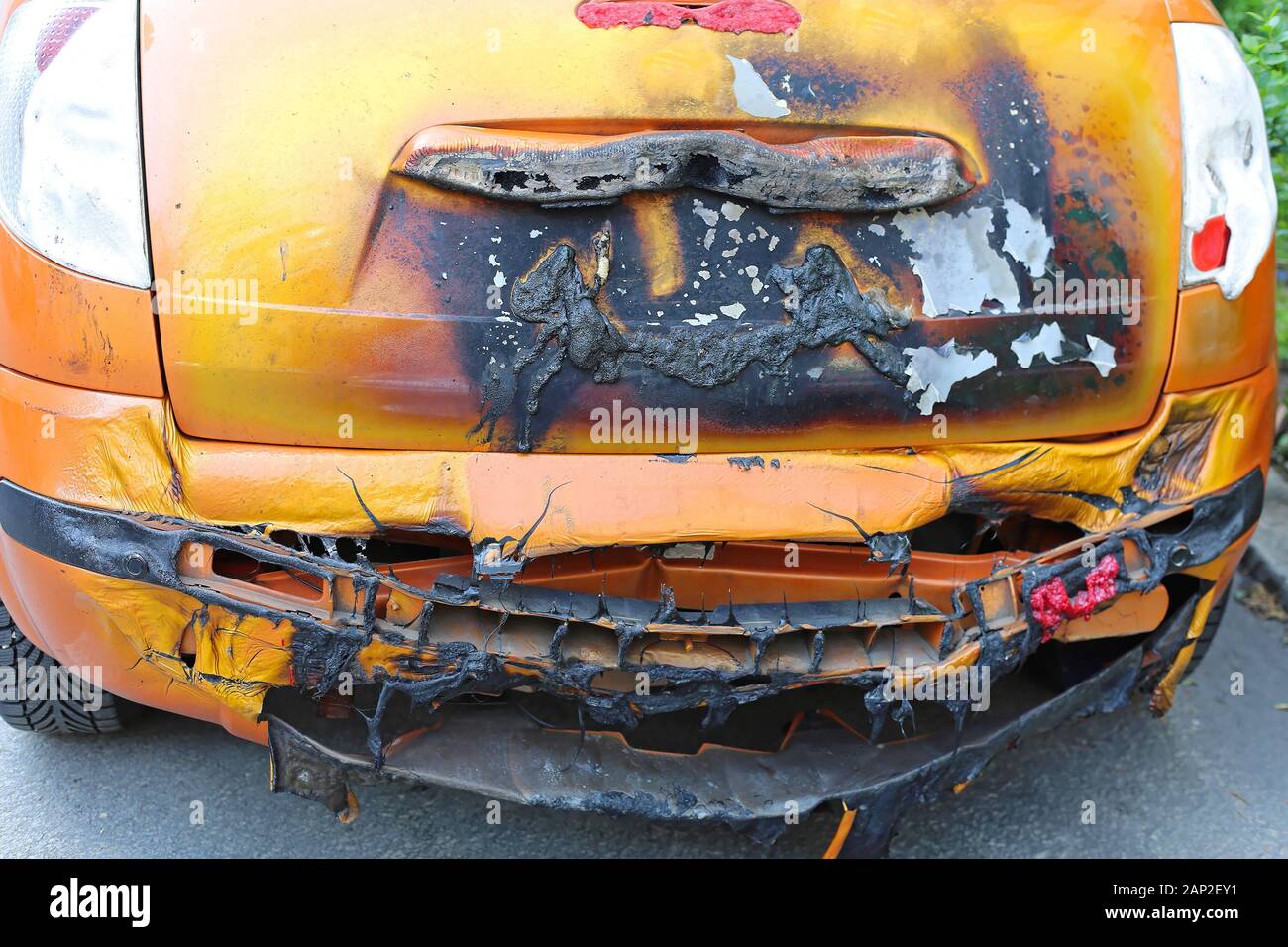 Melted and dameged car after fire inferno Stock Photo - Alamy